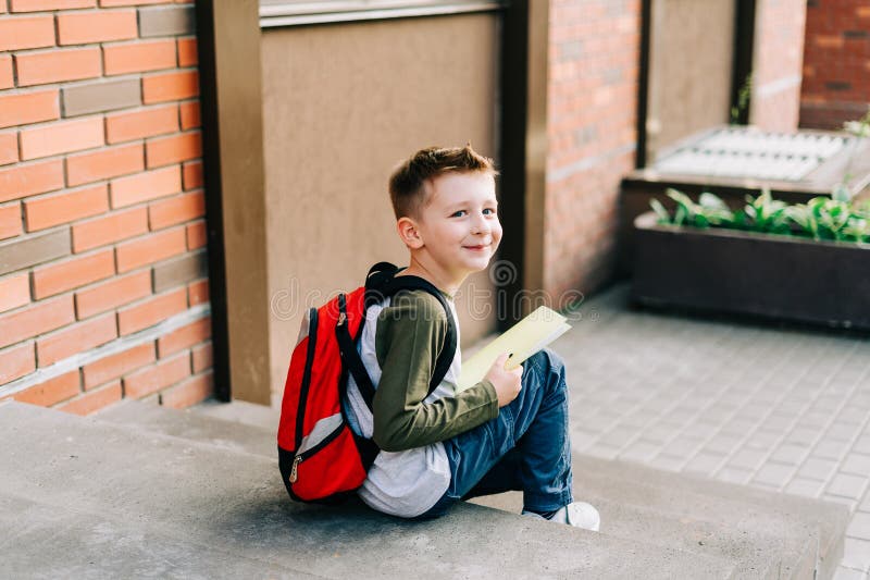 Back To School. Cute Child with Backpack, Holding Notepad and Training ...