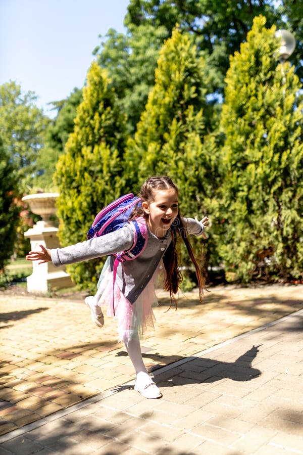 Back To School. Cute Child Girl with Backpack Running and Going To ...
