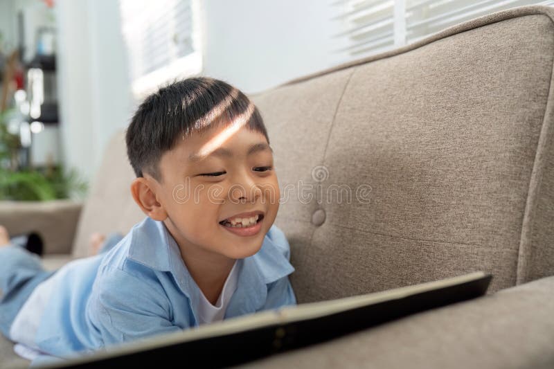 Back To School and Digital Learning. a Boy Happily Engaged with a Tablet, Embracing Modern ...