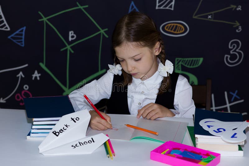 Back To School,the Child`s Hand Writes Letters in a Notebook Stock ...