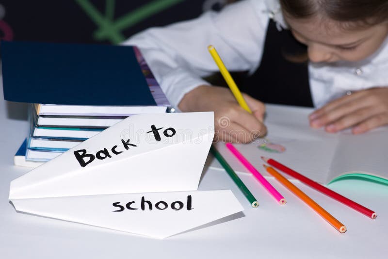 Back To School,the Child`s Hand Writes Letters in a Notebook Stock ...