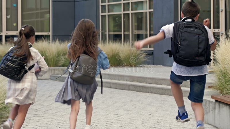 Group of Elementary School Students Rush To a Lesson To School. Back To ...