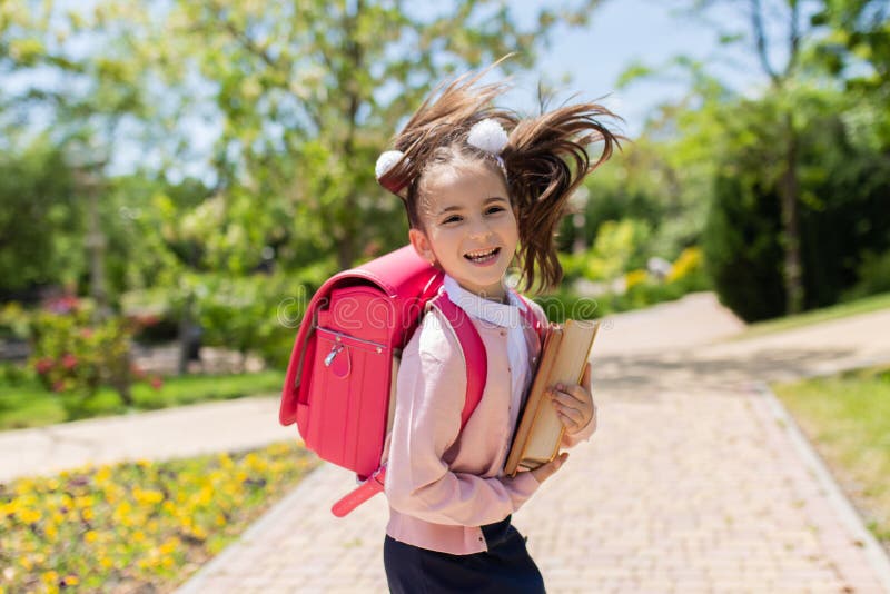 Back To School. Happy Smiling Kid Go To Elementary School. Child with ...