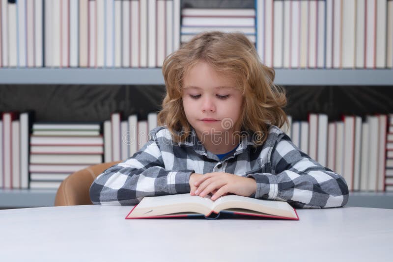 Back To School. Kid Reading a Book in a School Library. School Boy ...