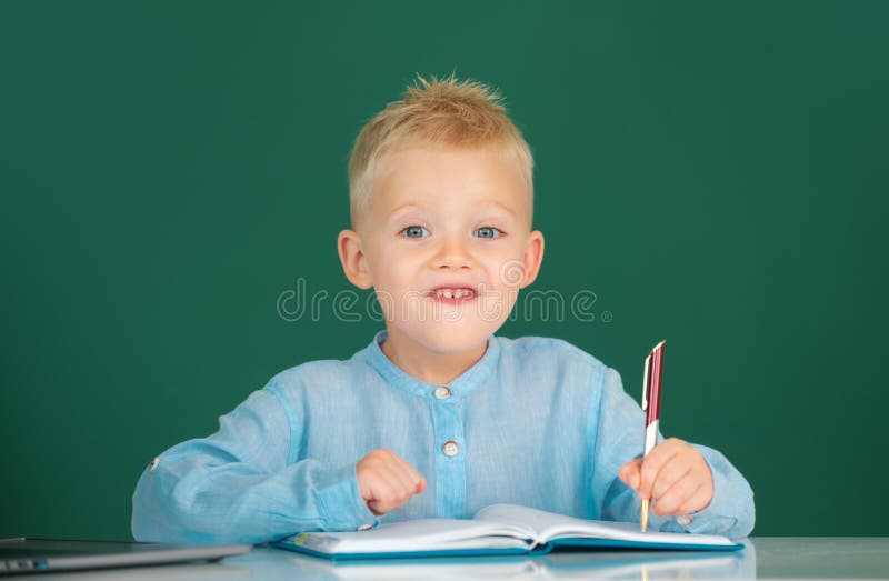 Back To School. Kid Writing in Class. Little Student Child Studying in ...