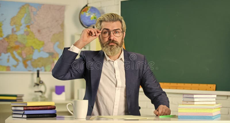 Back To School. Knowledge Day. Man School Teacher Sit in Classroom ...