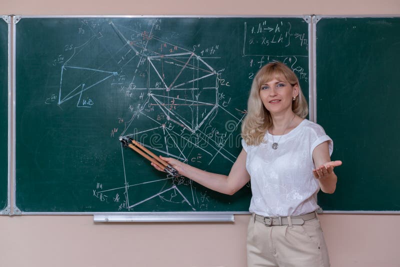 Back To School. the Professor Solves the Problem at the Blackboard ...