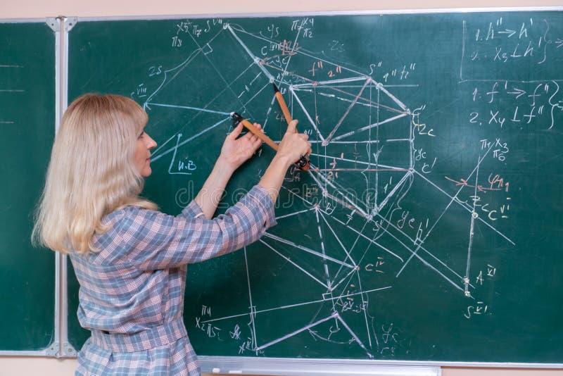 Back To School. the Professor Solves the Problem at the Blackboard ...