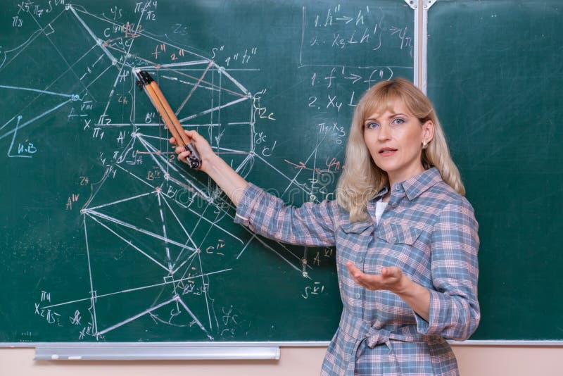 Back To School. the Professor Solves the Problem at the Blackboard ...