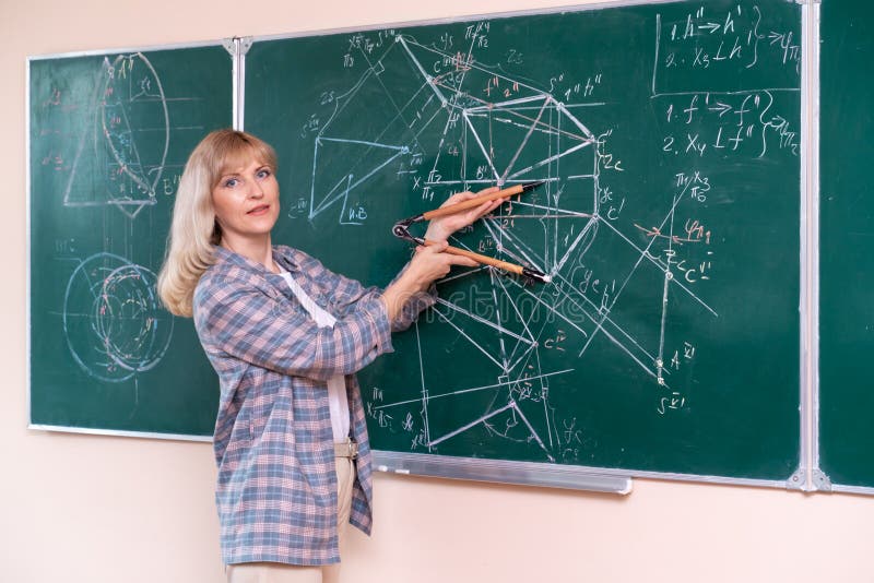 Back To School. the Professor Solves the Problem at the Blackboard ...