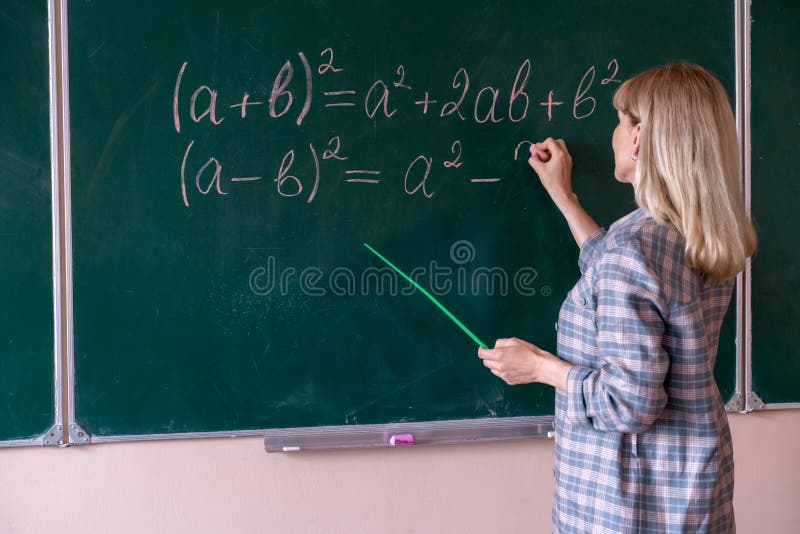 Back To School. the Professor Solves the Problem at the Blackboard ...