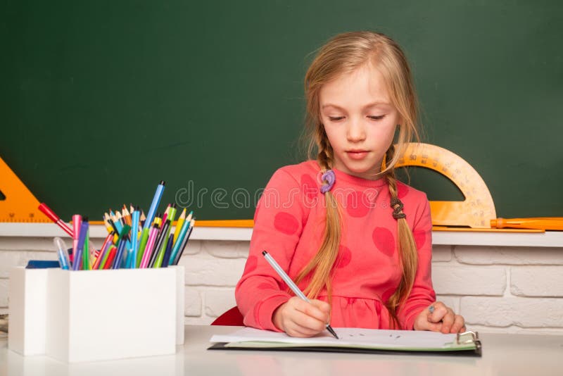 Back To School. Schoolgirl Learning in Classroom. Education for Kids ...