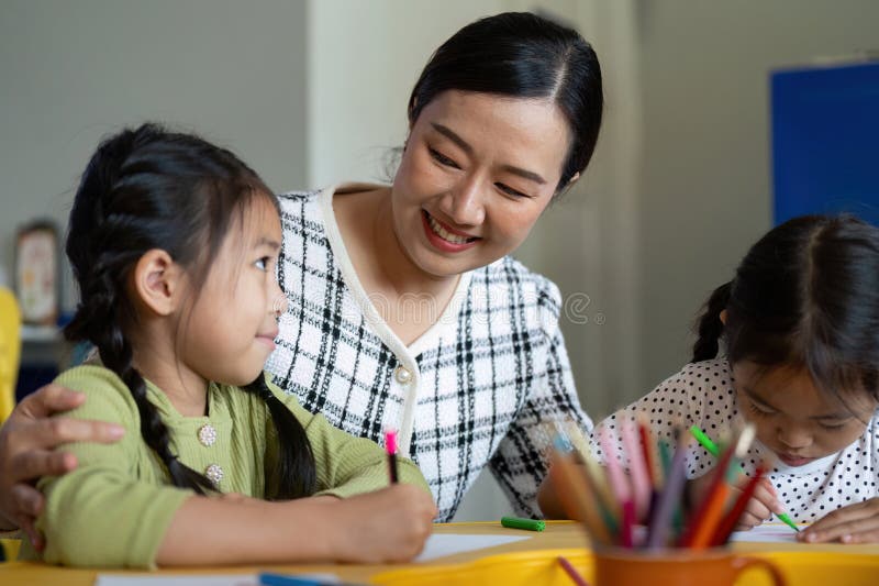 Back To School. Teacher Engaging with Students during a Creative ...