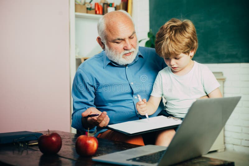 Back To School. Teacher and Pupil Learning Together in School. Stock ...