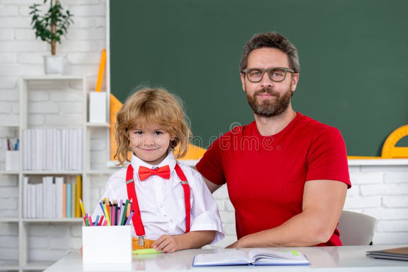 Back To School. Teacher and Schoolboy Learning in Class at School ...