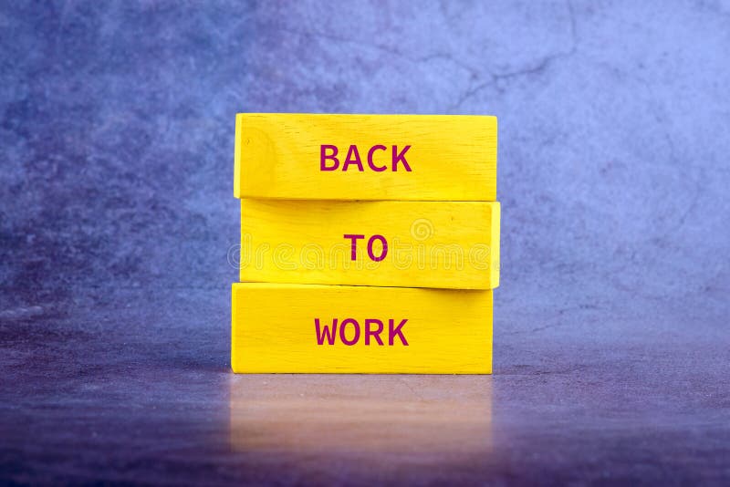 BACK TO WORK Written on Wooden Blocks on an Abstract Bright Background ...
