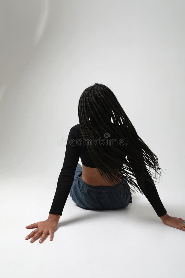 Back View of African American Woman with Long Braids, Posing at Studio ...