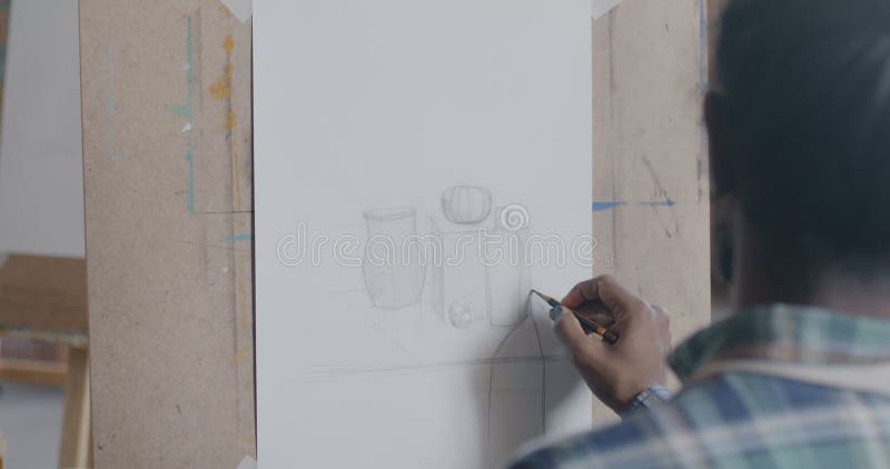 Back View of Students Male and Female Drawing Learning Together during ...