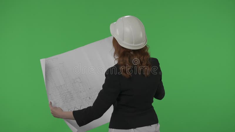 Back View of an Architect Woman Holding a Plan of a Building in Her ...