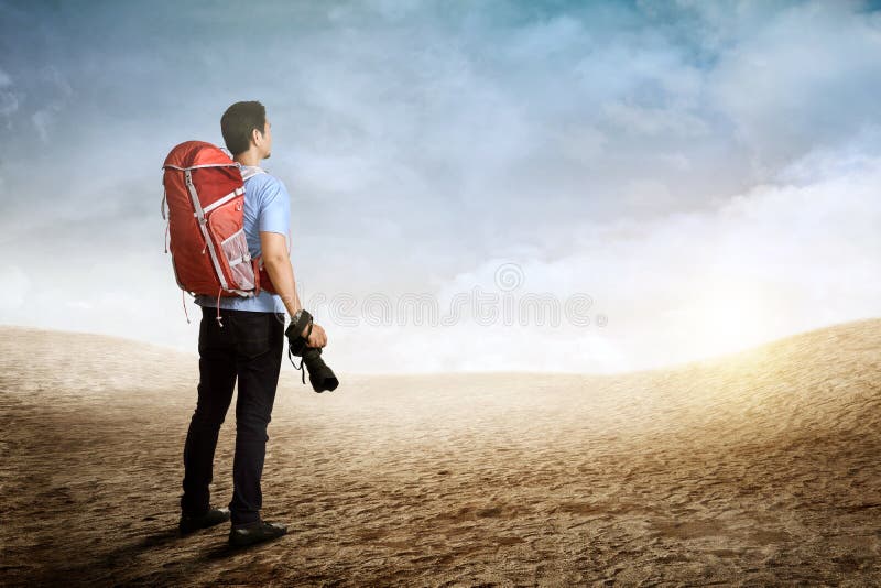 Back View of Asian Backpacker Man Holding Camera Stock Photo - Image of ...