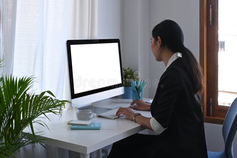 Asian Businesswoman Working with Computer at Modern Workplace. Stock ...