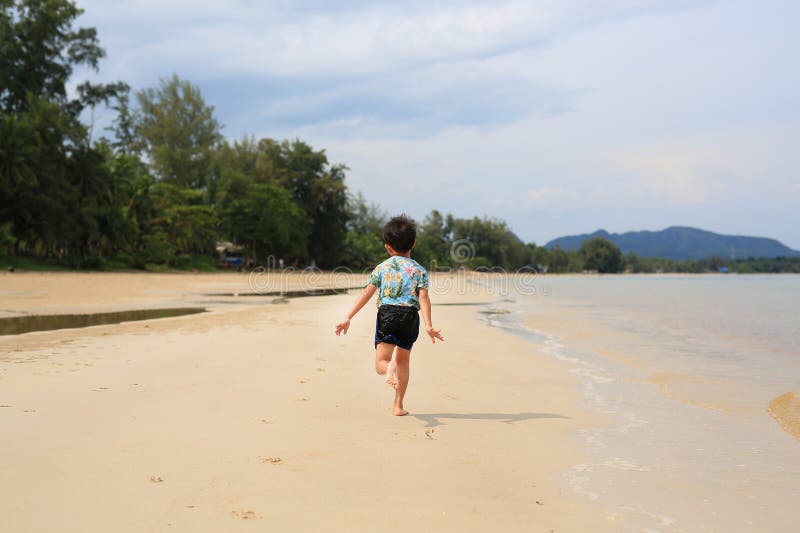 Back View of Asian Little Boy Having Fun Running on Tropical Sand Beach ...