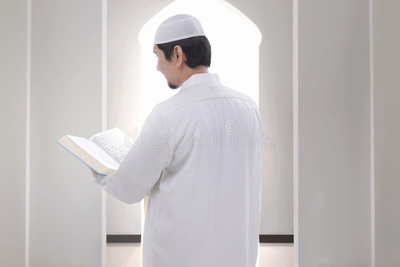 Back View of Asian Muslim Man Reading the Koran Stock Photo - Image of ...