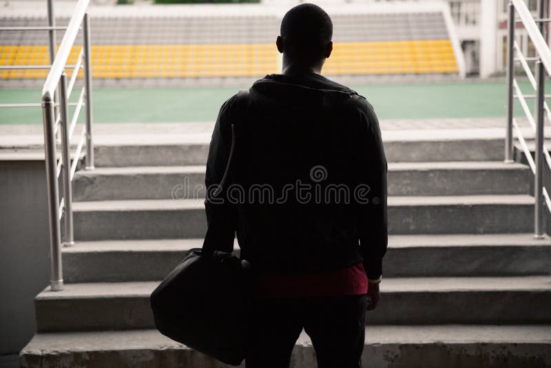 Back View of a Athletic Man with Bag Standing at the Stadium Stock ...