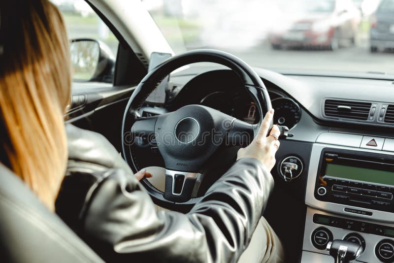 Back View of an Attractive Woman while Driving a Car Stock Image ...