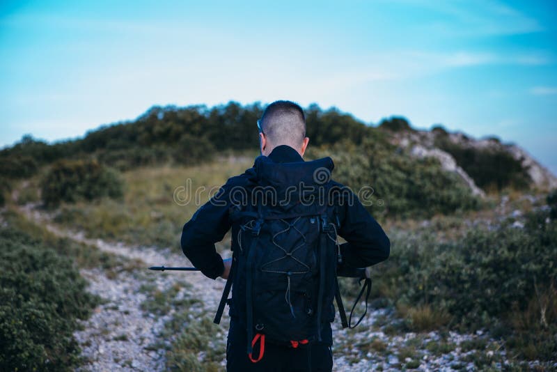 Back View of Backpacker Walking Stock Photo - Image of horizontal ...
