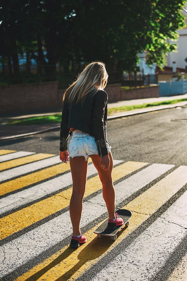 Back View of Beautiful Girl with Skateboard in the City Stock Photo ...