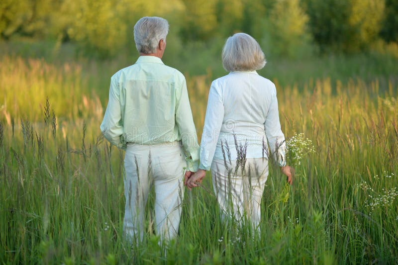 Back View of Beautiful Senior Couple in the Park Stock Photo - Image of ...