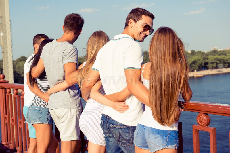 Back View of Best Friends Standing on the Bridge and Huging Stock Image ...