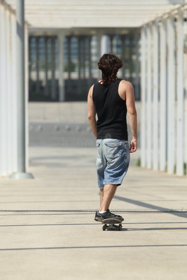 Back View of a Boy in a Skateboard Stock Image - Image of board, motion ...