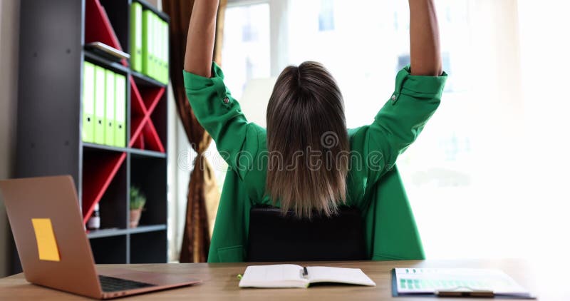 Back View of Business Woman Resting with Raised Hands at Table in ...