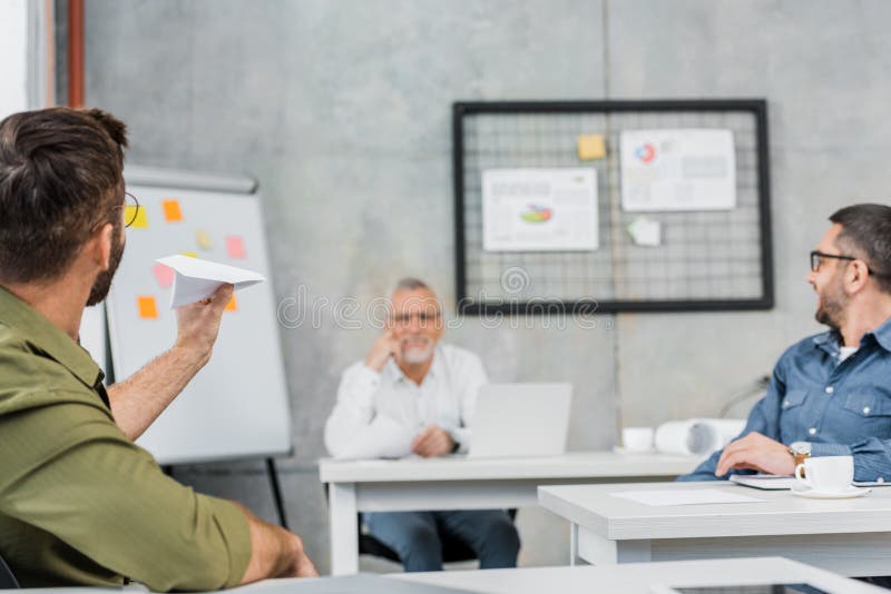 Back View of Businessman Holding Paper Plane Stock Photo - Image of ...