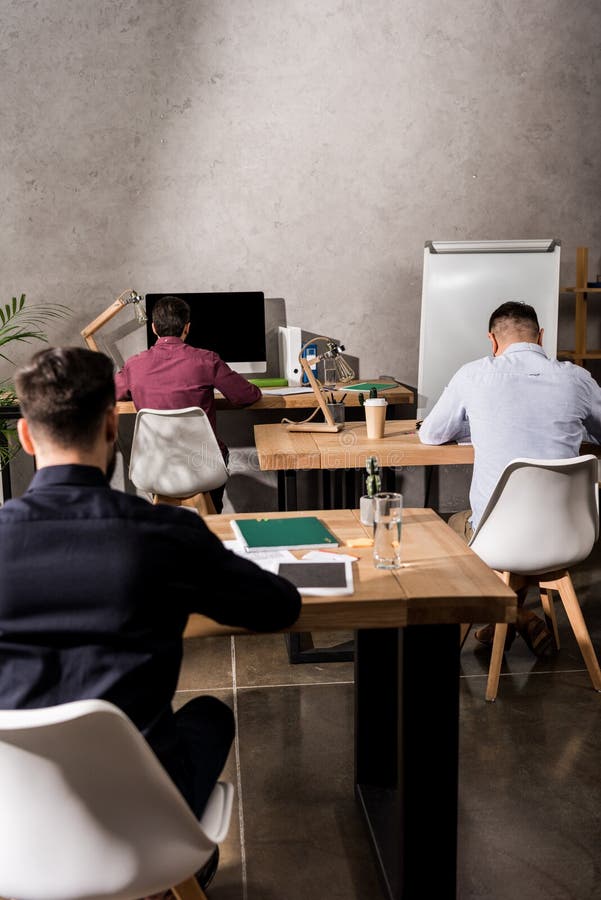 Back View of Businessmen Sitting at Working Tables Stock Image - Image ...