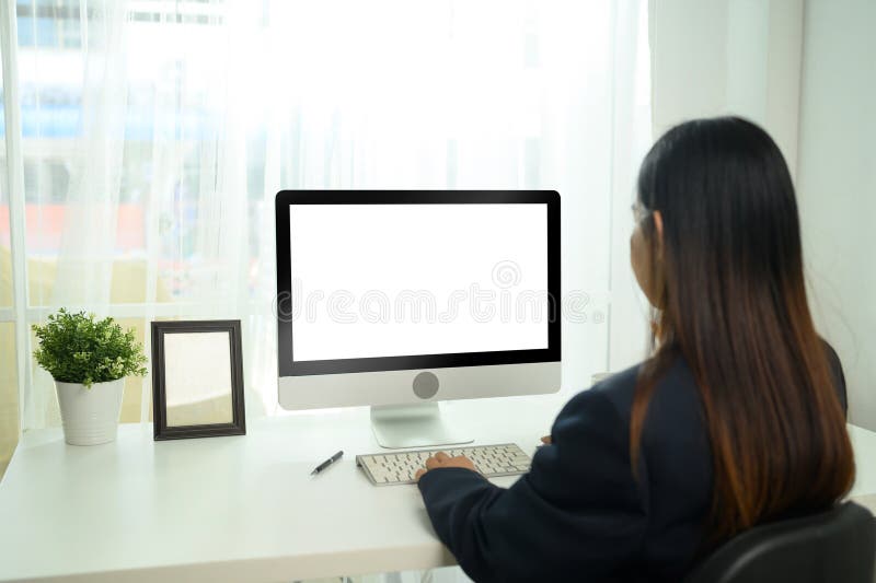 Back View of Businesswoman Sitting at Desk and Focused on Desktop ...