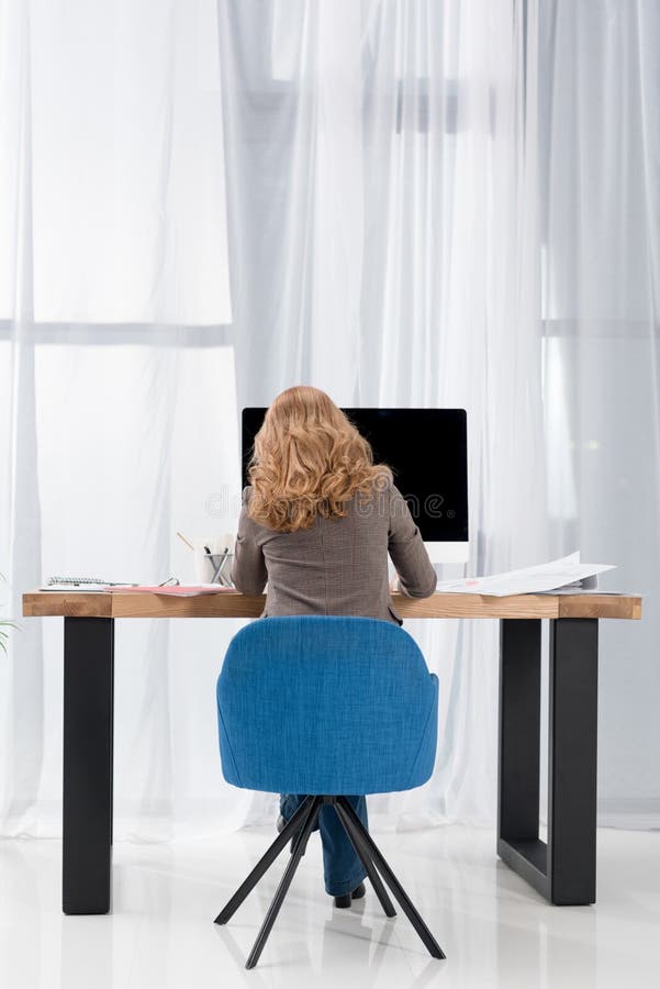 Back View of Businesswoman Working at Workplace with Computer Screen ...