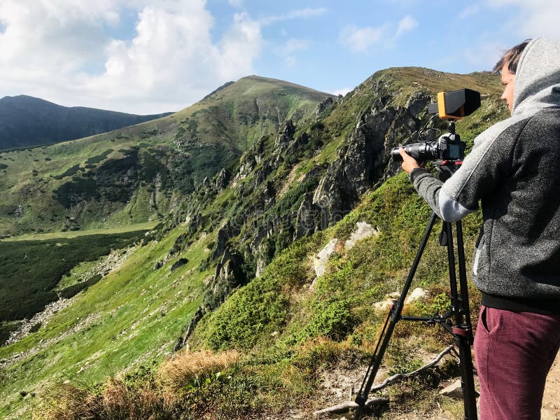 Back View Cameraman Shooting Mountain Landscape. Stock Photo - Image of ...