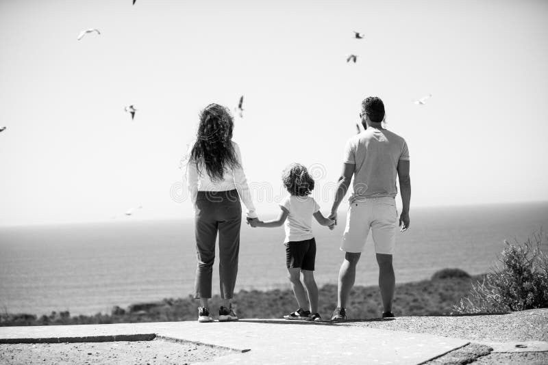 Back View of Carefree Family on the Beach Vacation. Stock Photo - Image ...