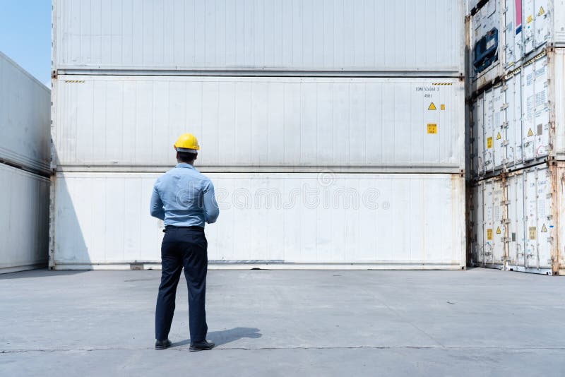 View of Caucasian Cargo Container Site Manager Against Stack of White ...