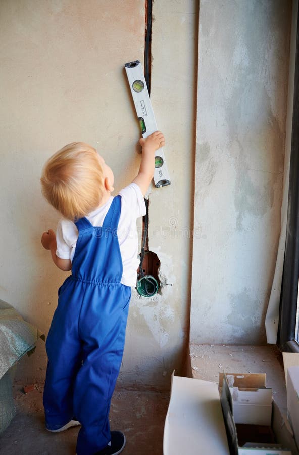 Little Boy Repairing Electrical Control Panel at Home. Stock Image ...
