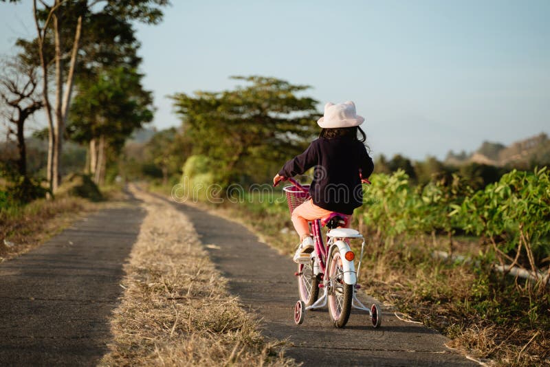 Back View of a Child Riding a Bicycle Stock Photo - Image of bicycle ...