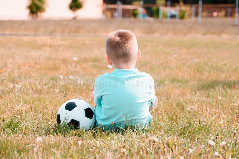 Back View of a Child in Sportswear with Soccer Ball. Stock Photo ...