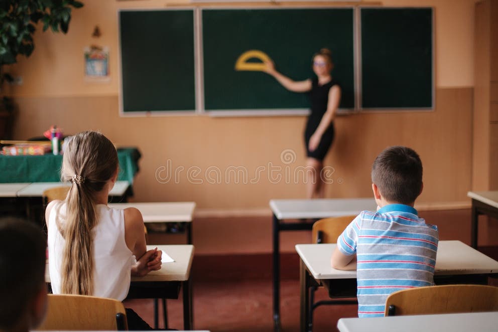 Back View of Children Sitting in the Class Room and Study. Elementary ...