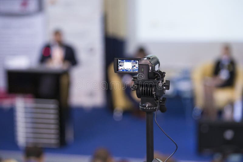 Back View of Compact Videocamera. Positioned Against Blurred Background ...