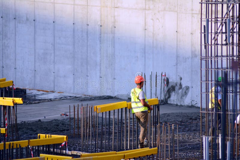 Back View of a Construction Worker Walking into a Building Sites ...