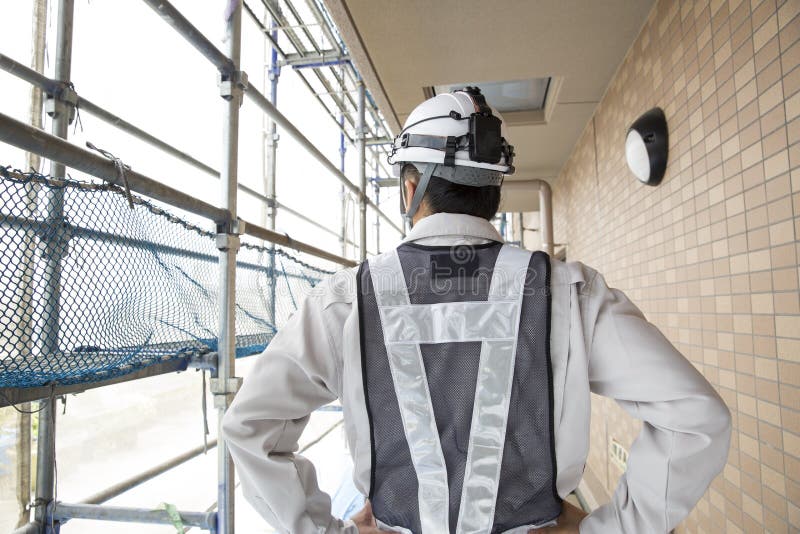 Back View of Construction Workers Stock Photo - Image of back, field ...