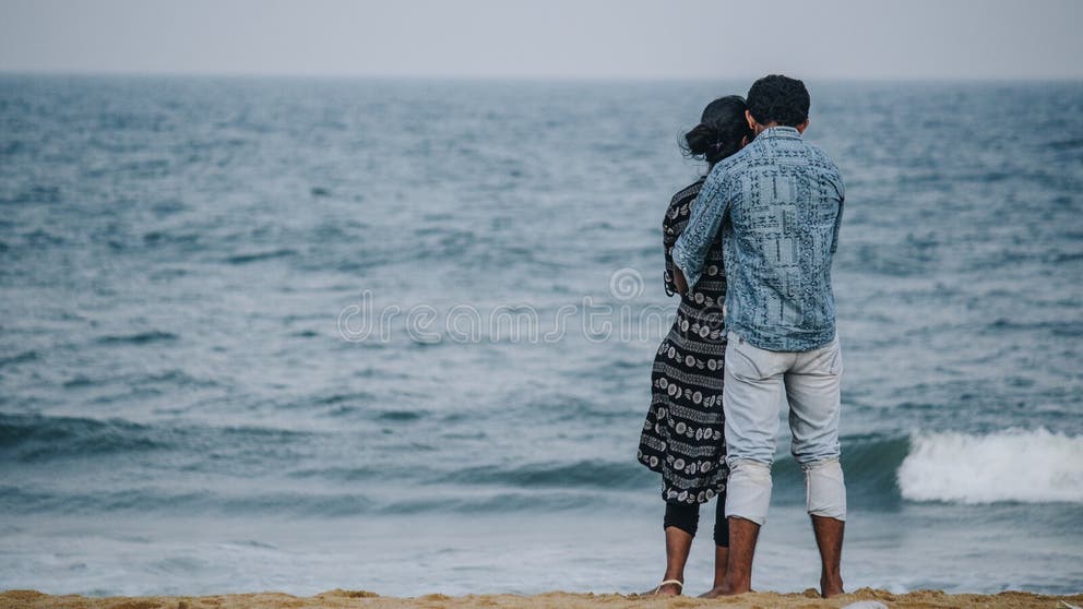 Back View of a Couple Cuddling at the Beach Stock Photo - Image of ...